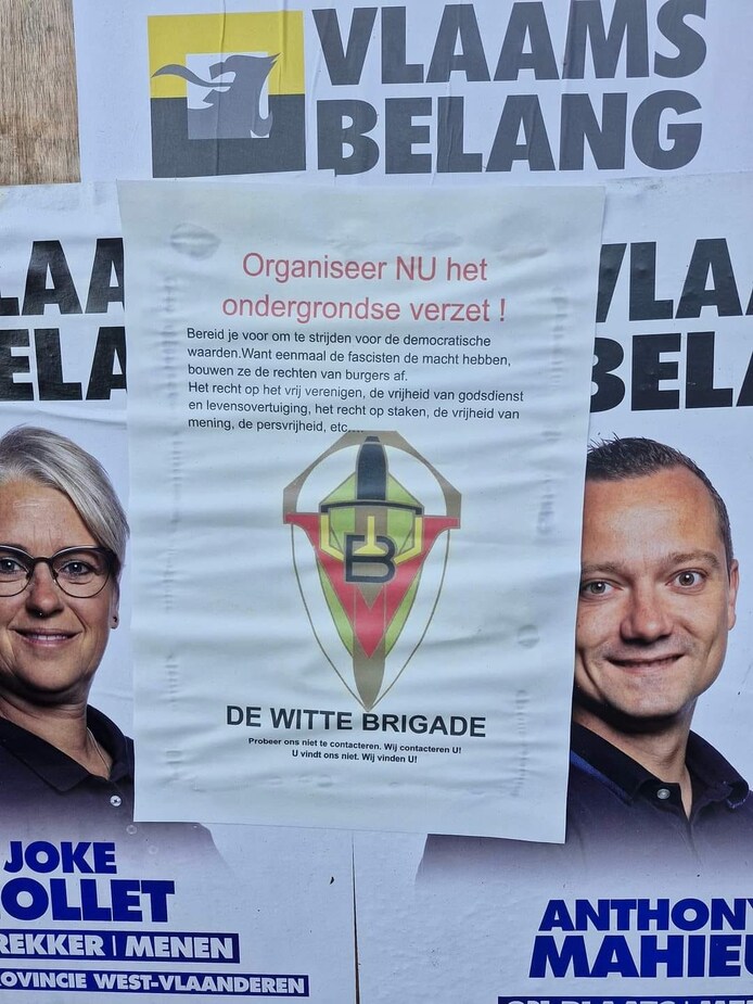 ‘De Witte Brigade’ overplakt affiches Vlaams Belang in Menen: “We ...